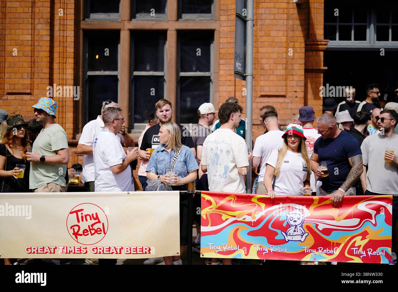 Oasis fans enjoying a drink in the Cardiff sunshine, ahead of the first ...