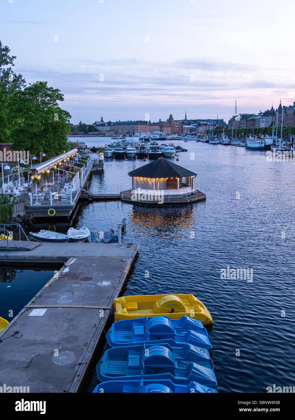 Stockholm, Sweden - June 3 2025: A serene waterfront scene at dusk ...