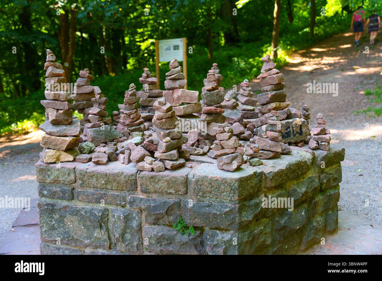 Public art installation of stacked stones in a wooded area of ...