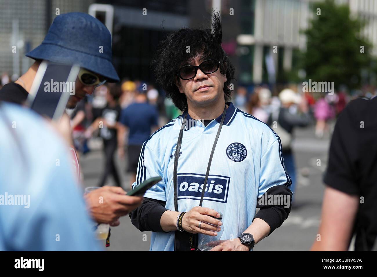 Fans gather for the Oasis reunion concert on Friday, July 4, 2025, in ...