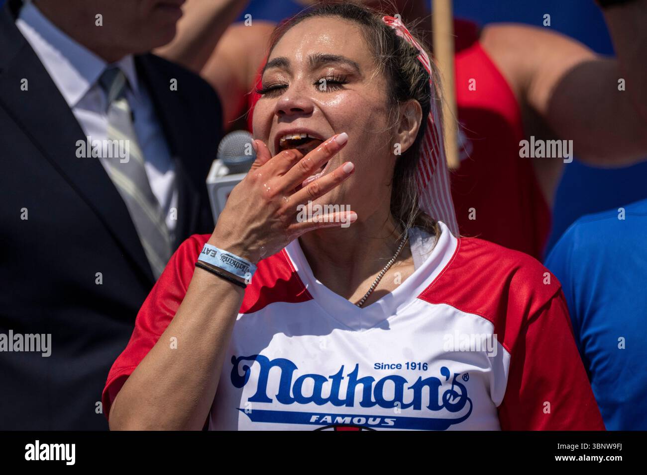 Competitive eater Miki Sudo eats hot dog during the 2025 Nathan's Famous Fourth of July hot dog ...