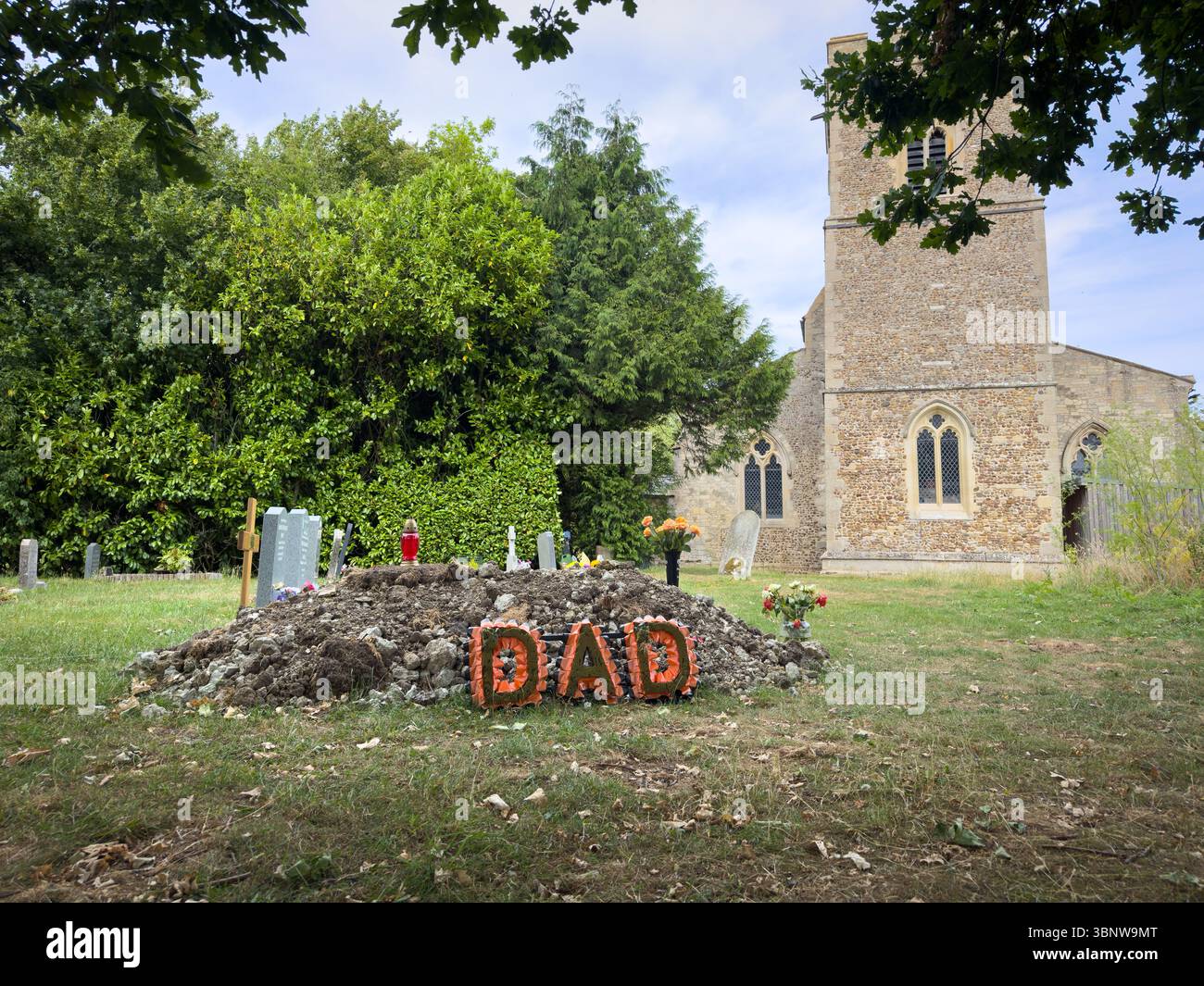 26 JUNE 2025 - Cambridgeshire, UK - A fresh grave burial mound in a ...