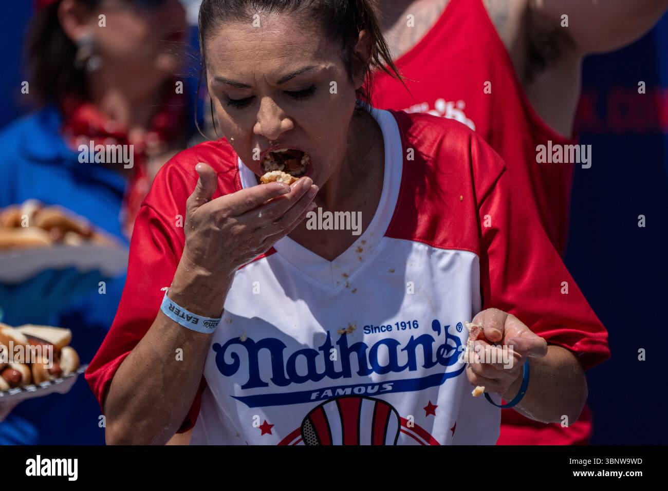 Competitive eater Michelle Lesco eats hot dog during the 2025 Nathan's ...