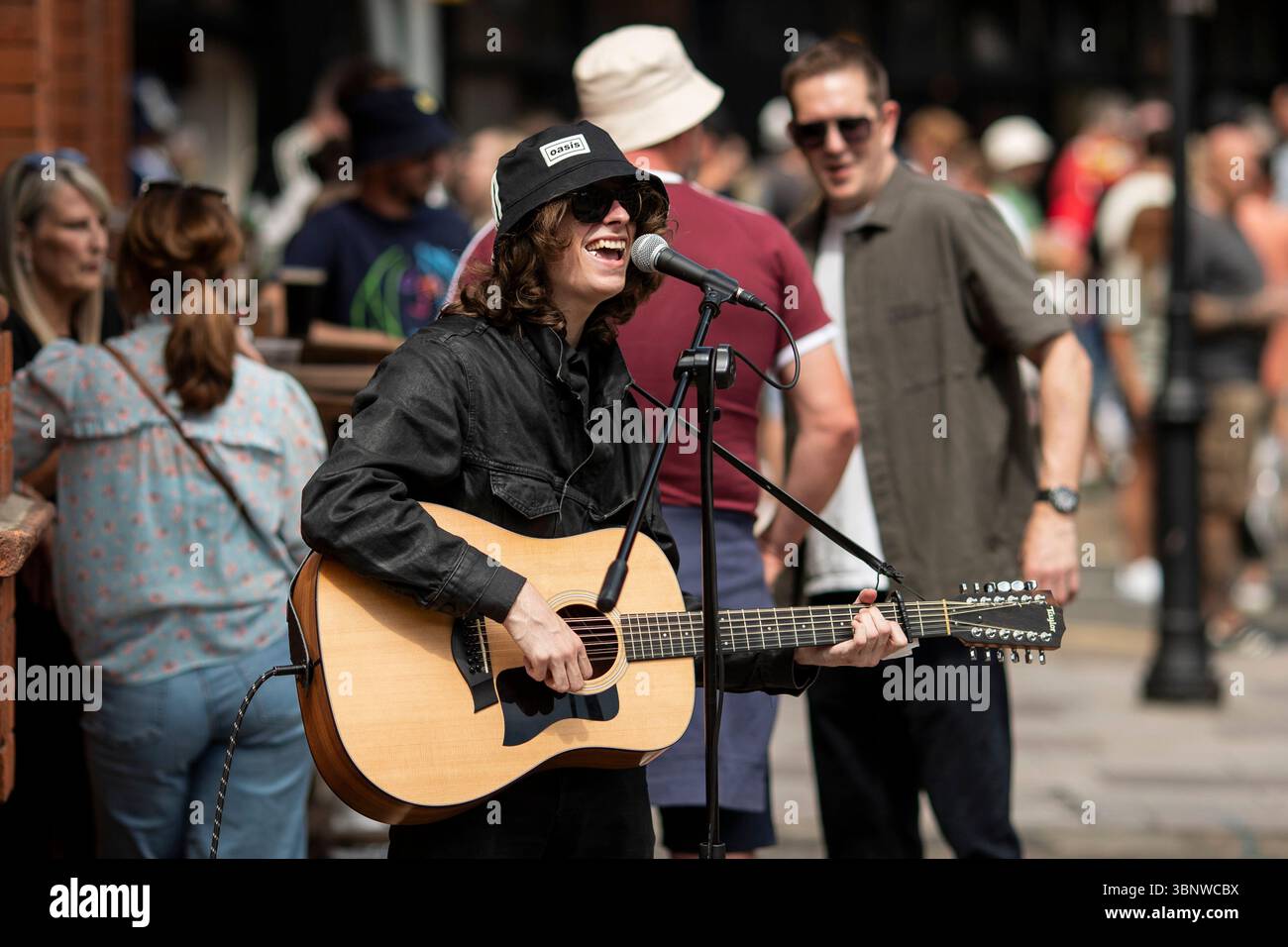 Cardiff, Wales, UK. 4th July, 2025. Oasis fans in Cardiff city centre ...