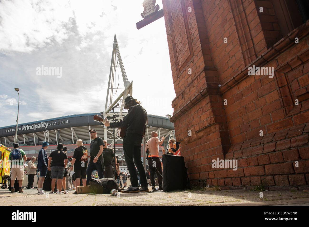 Cardiff, Wales, UK. 4th July, 2025. A man plays Oasis songs outside the ...