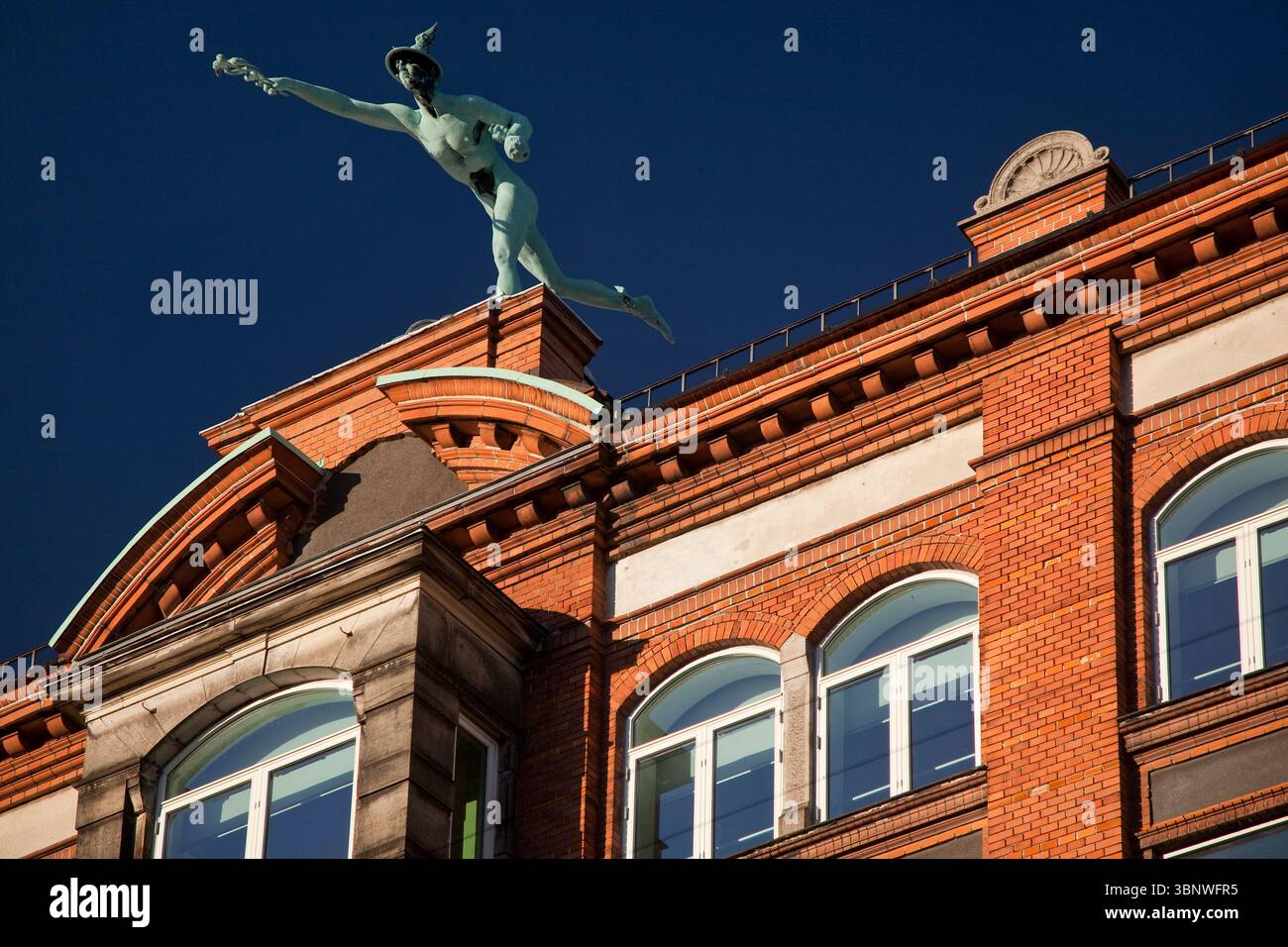 The statue of a flying Mercury on the rooftop of a building in ...