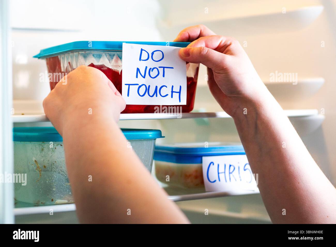 Office fridge with angry Do Not Touch My Food stickers on meal ...