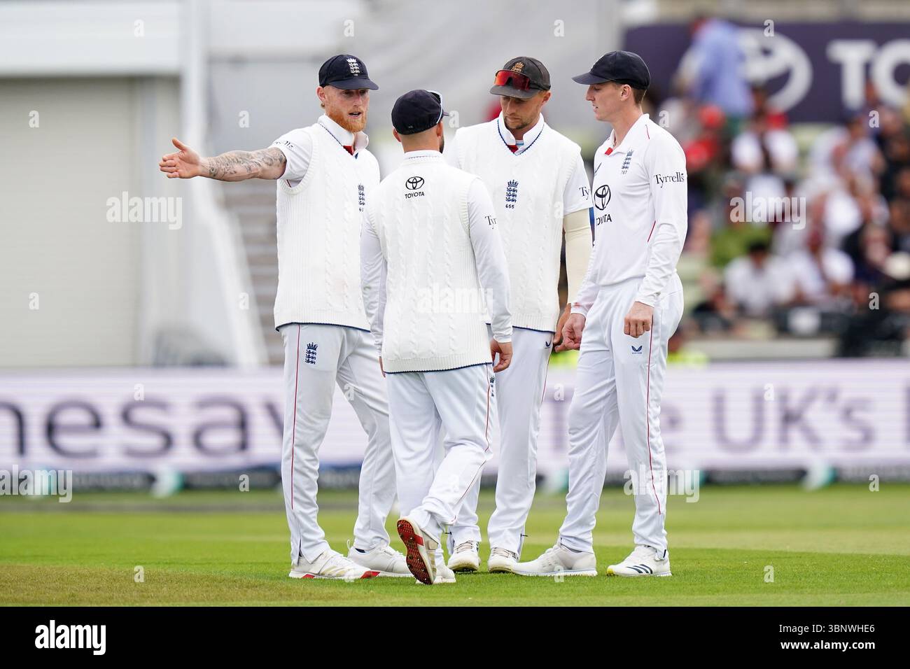 England's Ben Stokes (left) speaks with players Ben Duckett, Joe Root ...