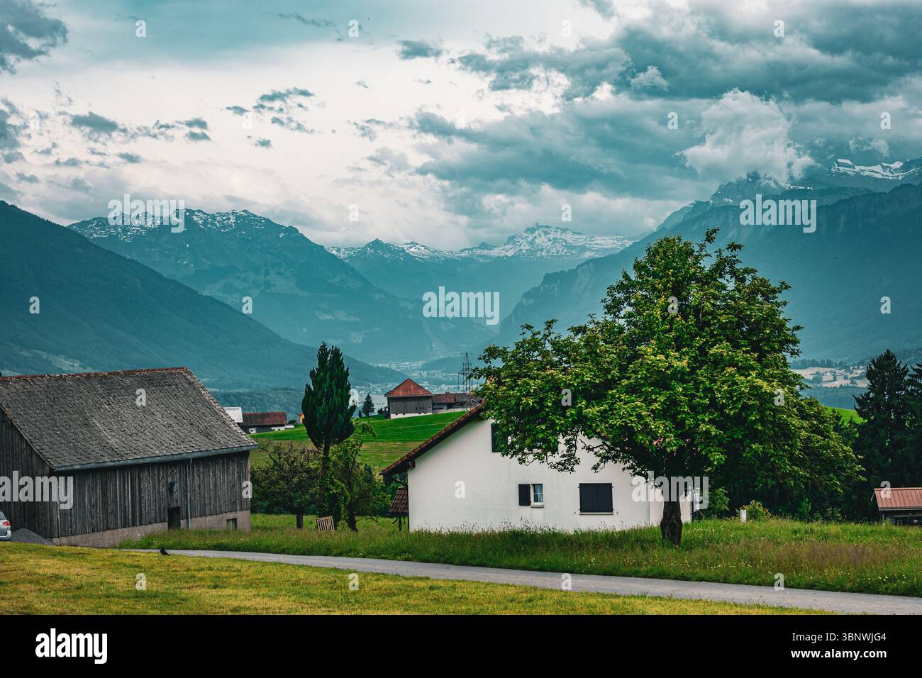 Charming view of a small Swiss village with traditional wooden houses ...