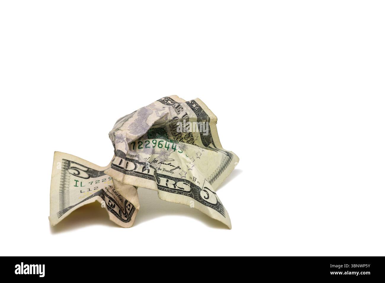A crumpled up five dollar bill Stock Photo - Alamy