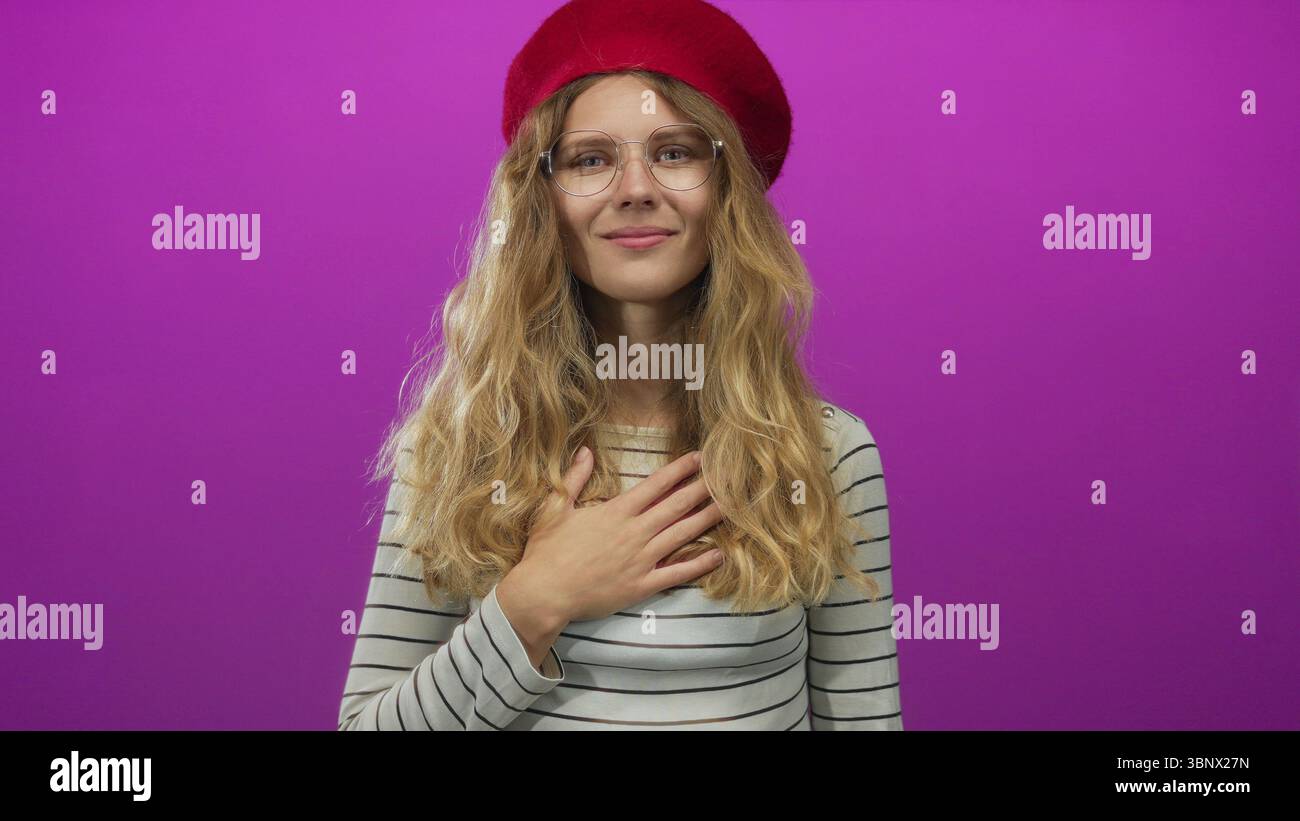 Woman places hand over chest hi-res stock photography and images - Alamy