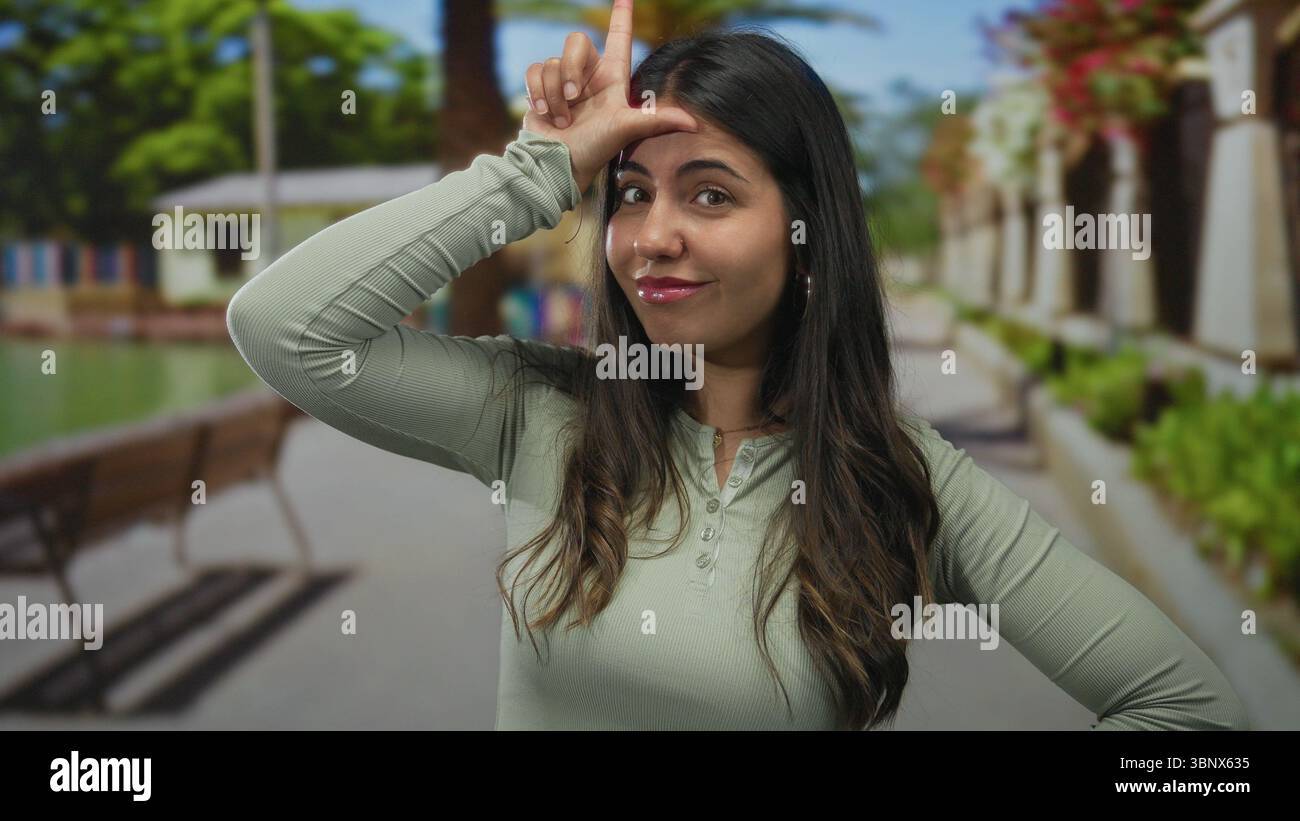 Woman makes mocking finger gesture hi-res stock photography and images ...