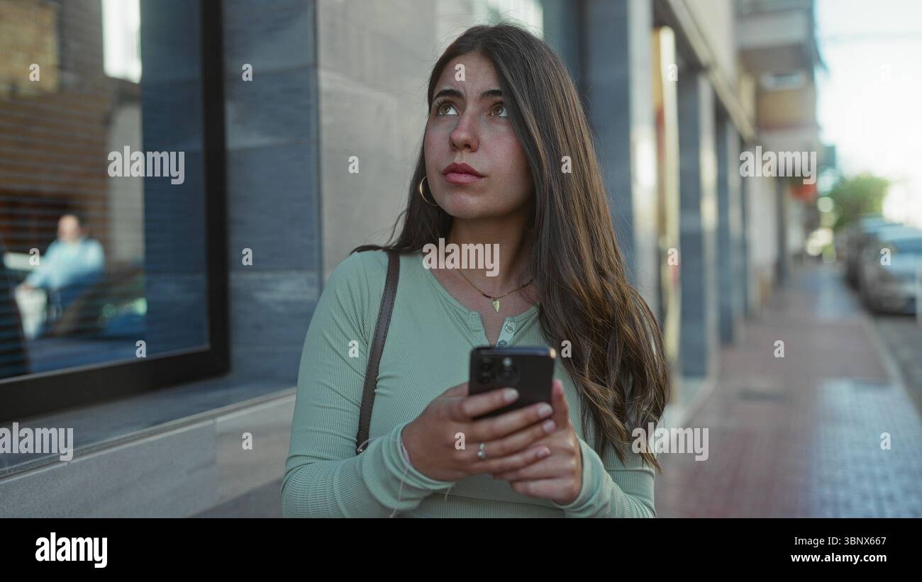 Female engaging smartphone amidst hi-res stock photography and images ...