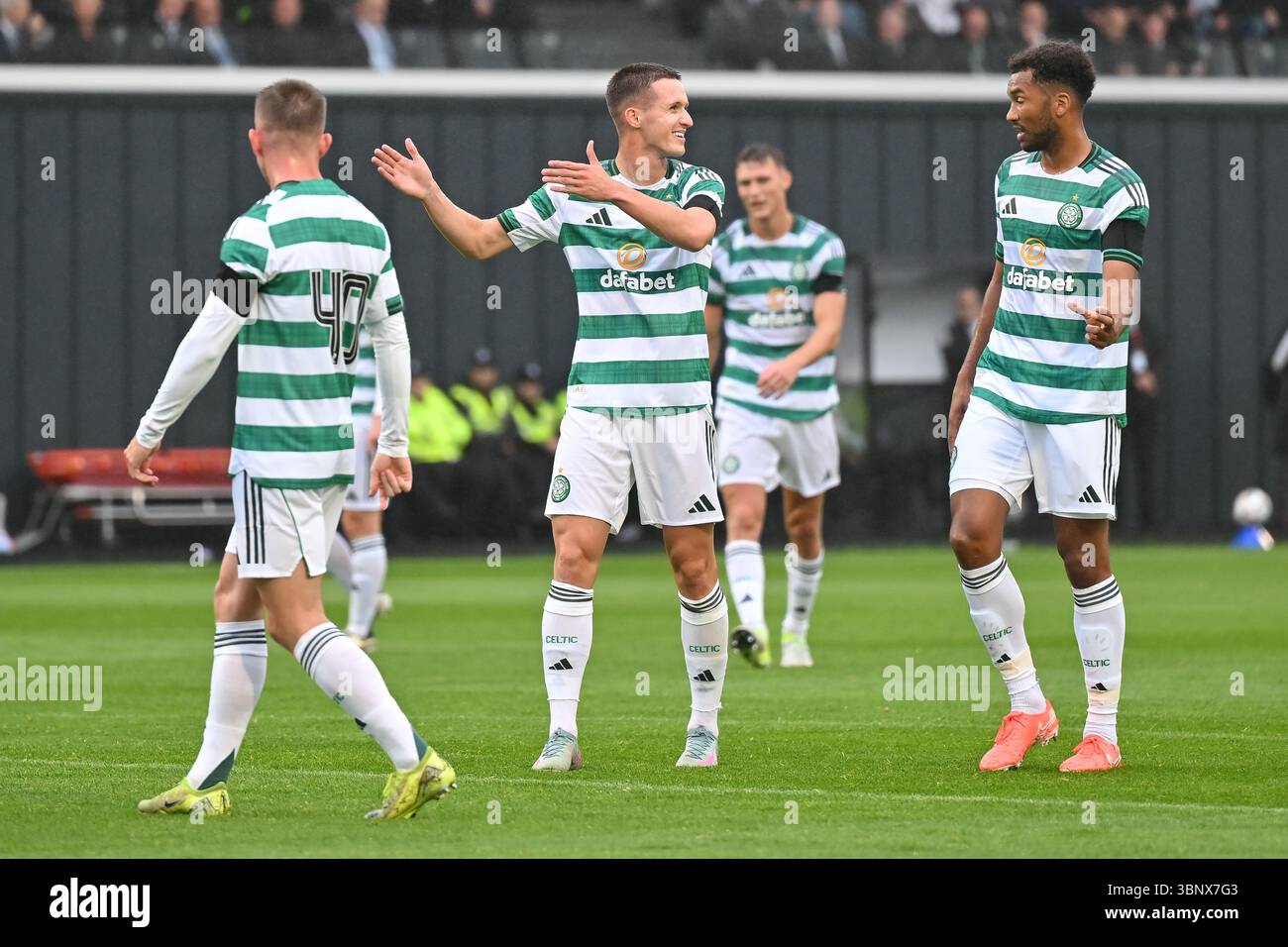 Glasgow, UK. 4th July, 2025. Johnny Kenny of Celtic and Auston Trusty ...