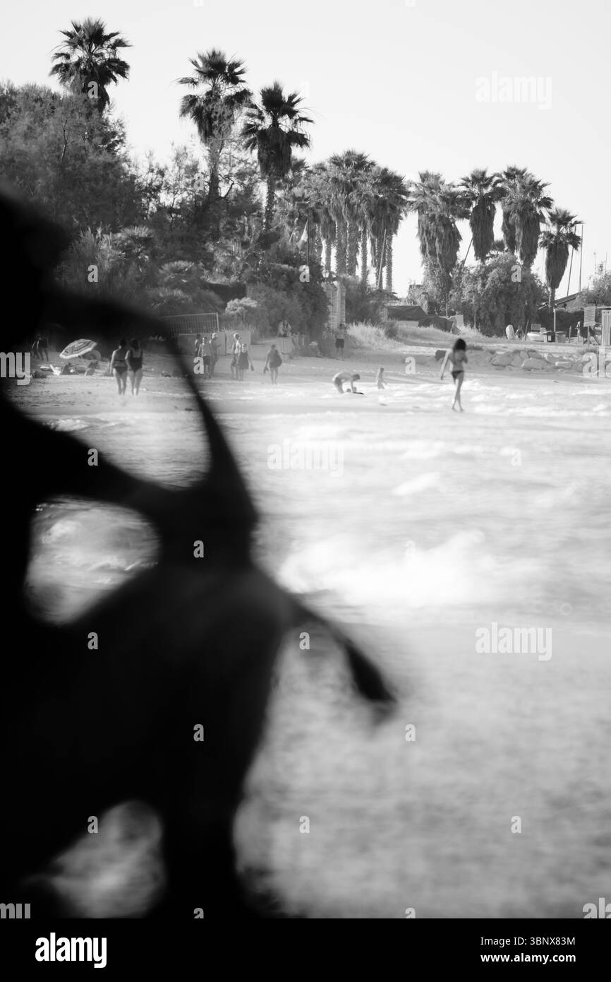 Sitting on beach looking Black and White Stock Photos & Images - Alamy