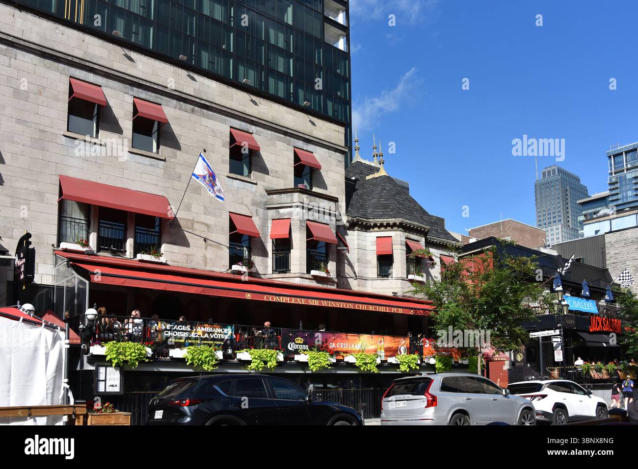 Montreal, Canada - June 29, 2025: Patrons enjoy the patios of the Sir ...