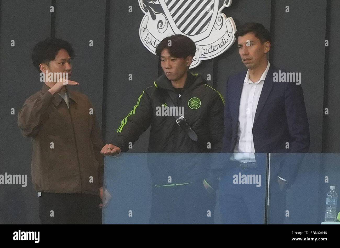 Celtic new signing Hayato Inamura (centre) watching the action from the ...