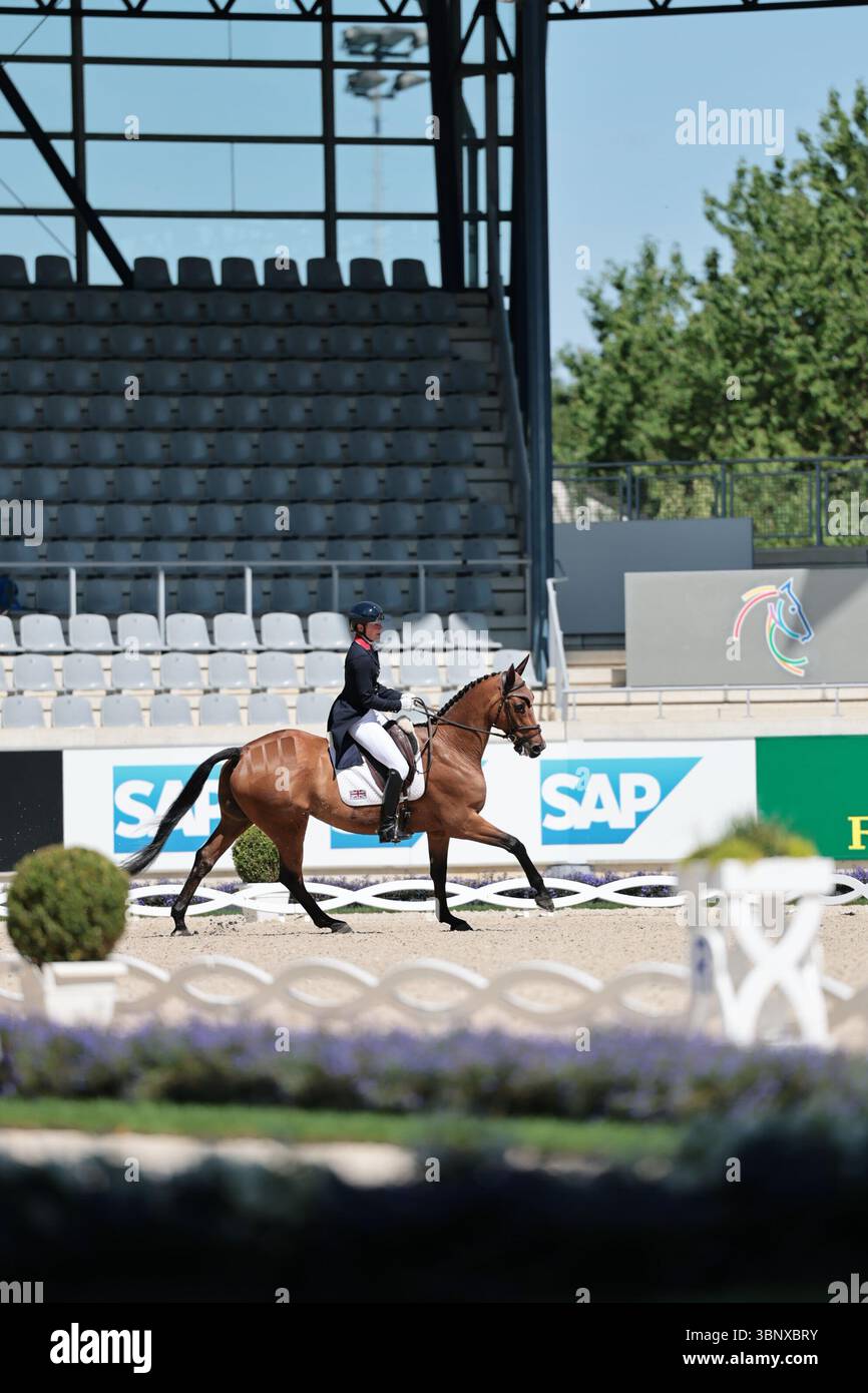 Caroline Harris of Great Britain with D. Day during the dressage of the ...