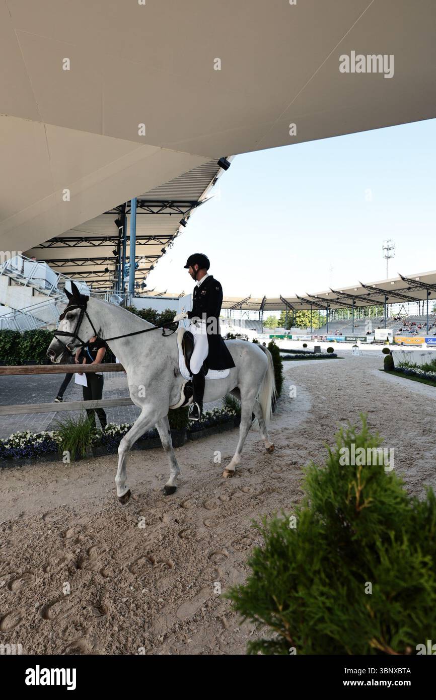 Clarke Johnstone of New Zealand with Rocket Man during the dressage of ...