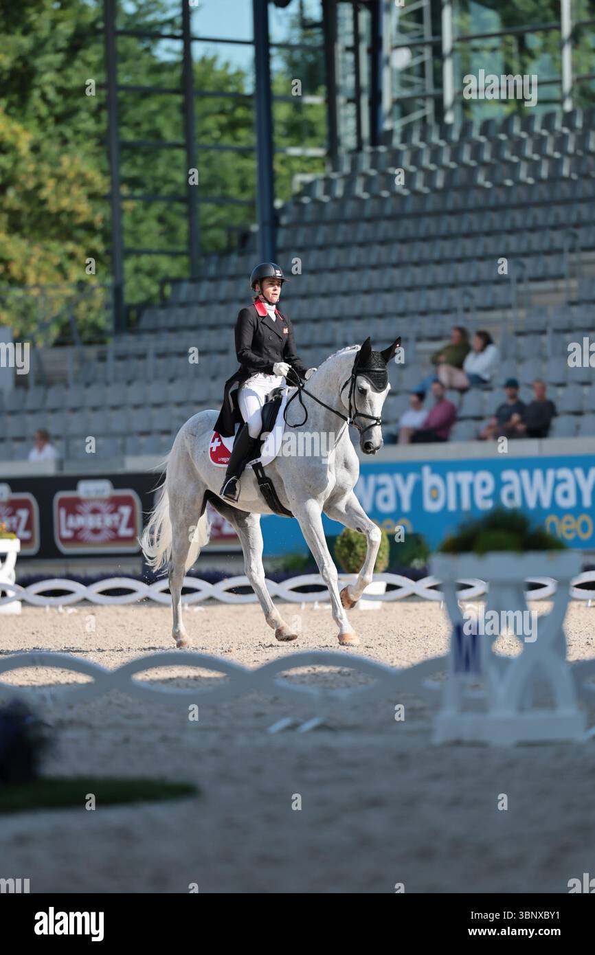 Mélody Johner of Switzerland with Erin during the dressage of the CCIO4* UBS Cup at the CHIO ...