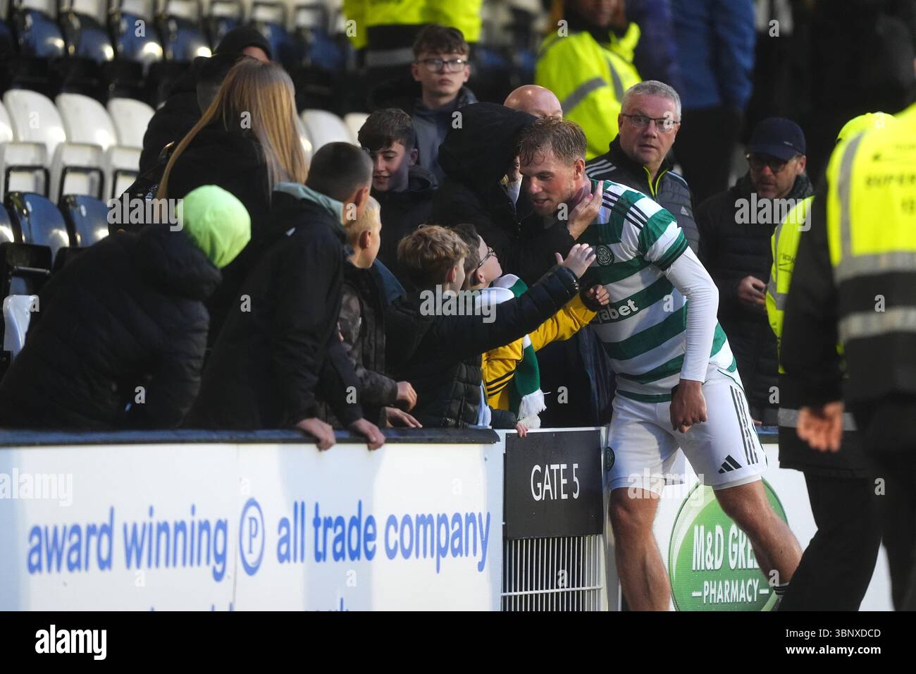 Celtic's Stephen Welsh takes photographs with fans following the pre ...