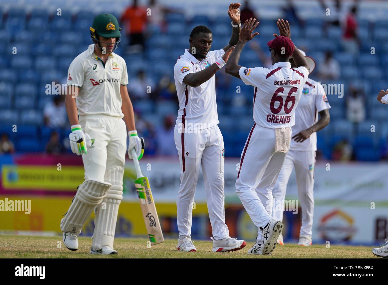 West Indies' Jayden Seales celebrates after bowling Australia's Sam ...