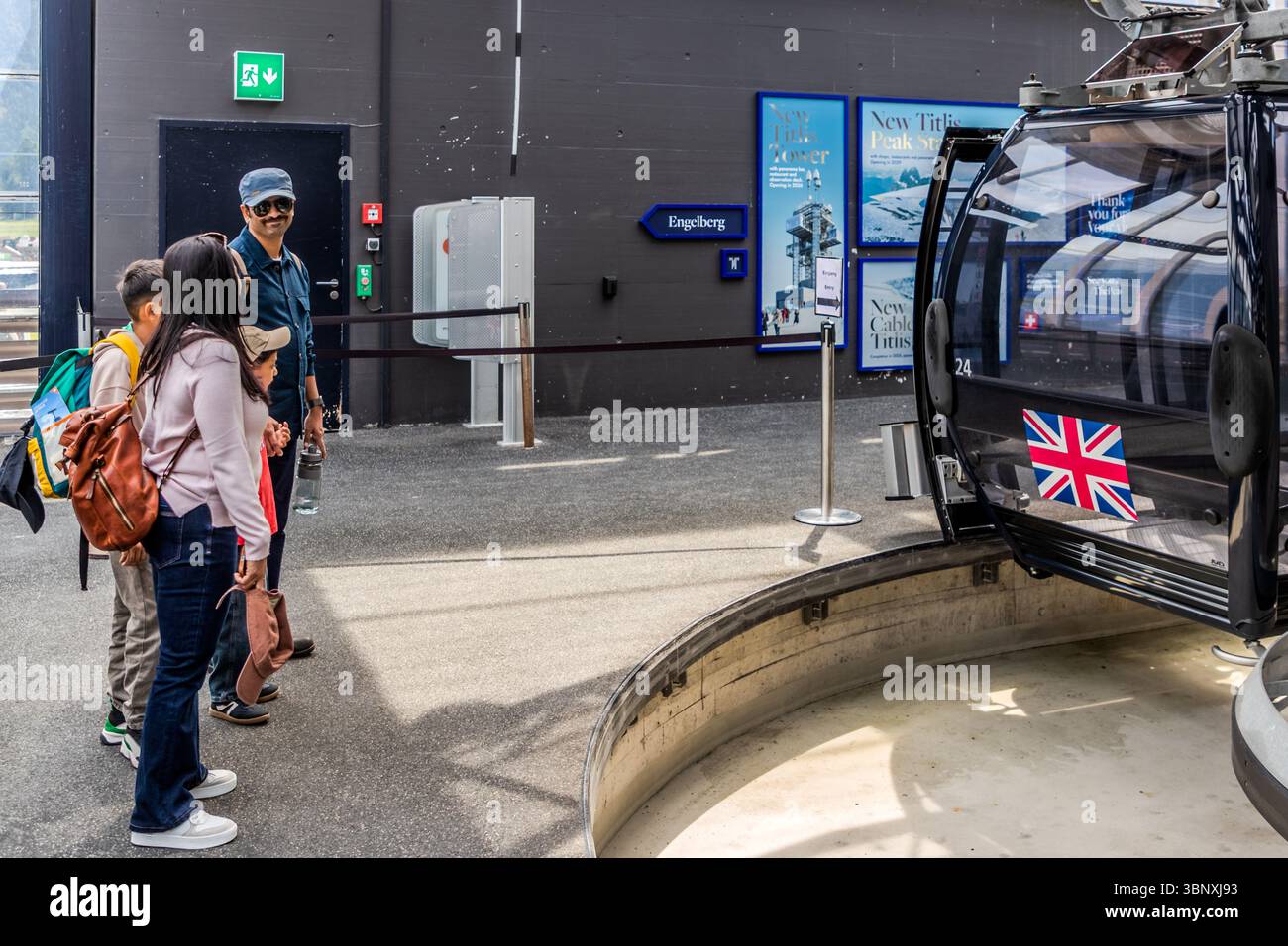On the way to Titlis, an Indian family boarding a gondola. An Indian ...