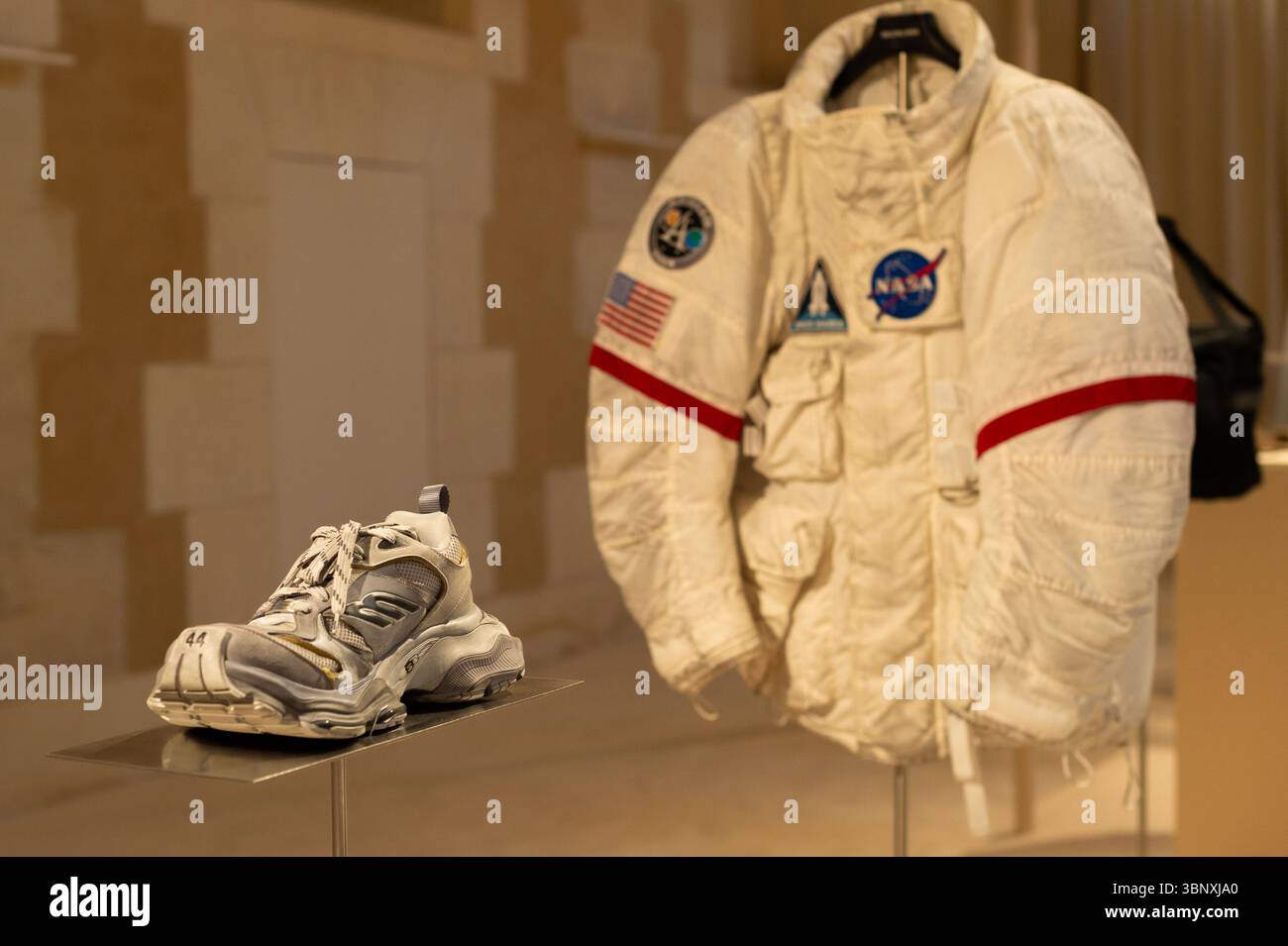 Paris, France - July 3 2025: A white puffer jacket with NASA patches ...