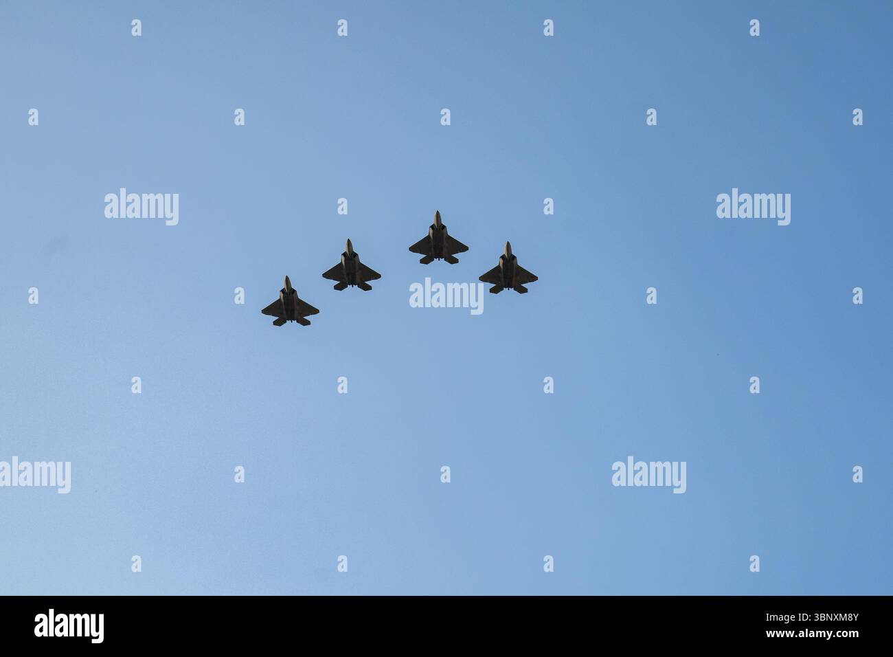 U.S. Air Force F-22 military aircraft perform a flyover over the ...