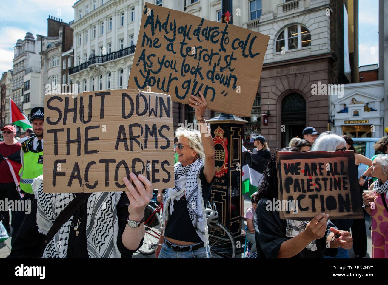 London, UK. 4th July, 2025. Pro-Palestinian activists hold signs ...