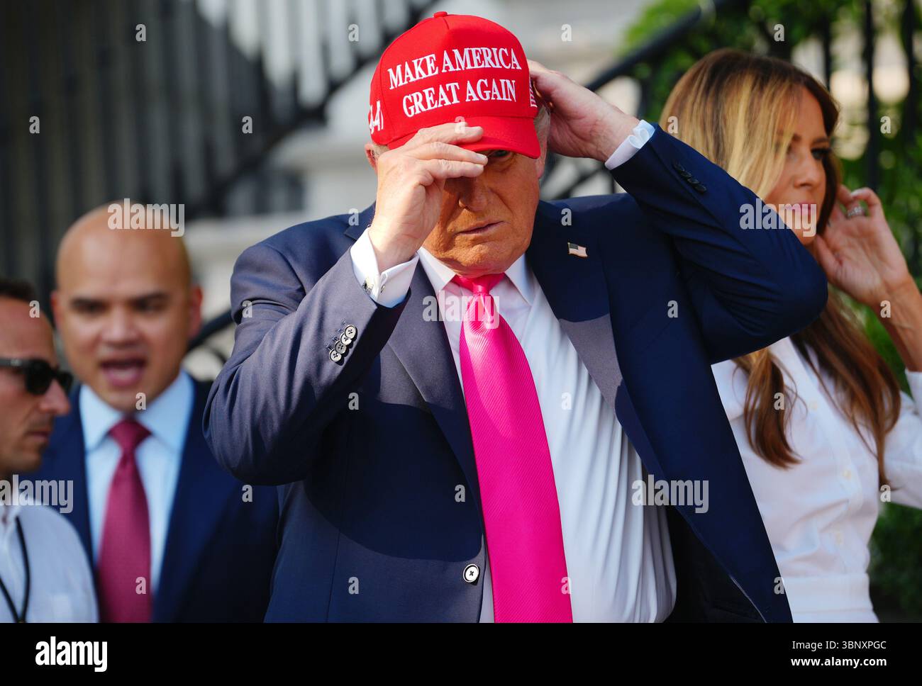 Washington, United States. 04th July, 2025. President Donald Trump puts ...