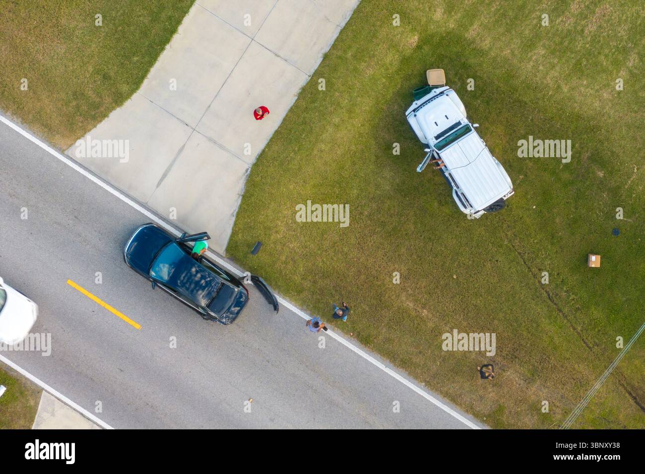 First responders responding to car accident site on American street ...