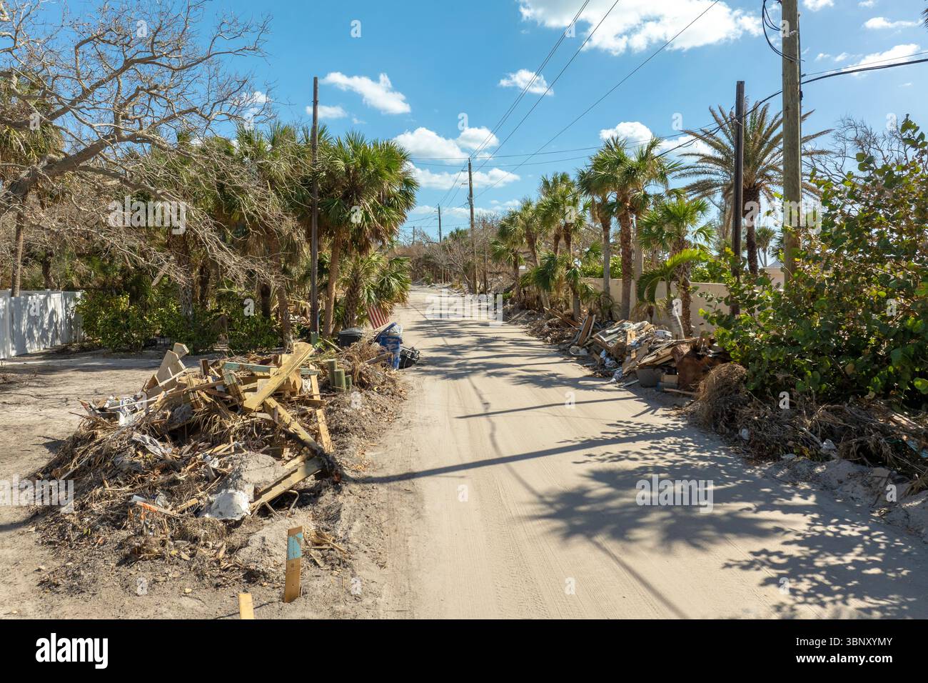 Piles of debris on street side after hurricane Milton on Manasota key ...