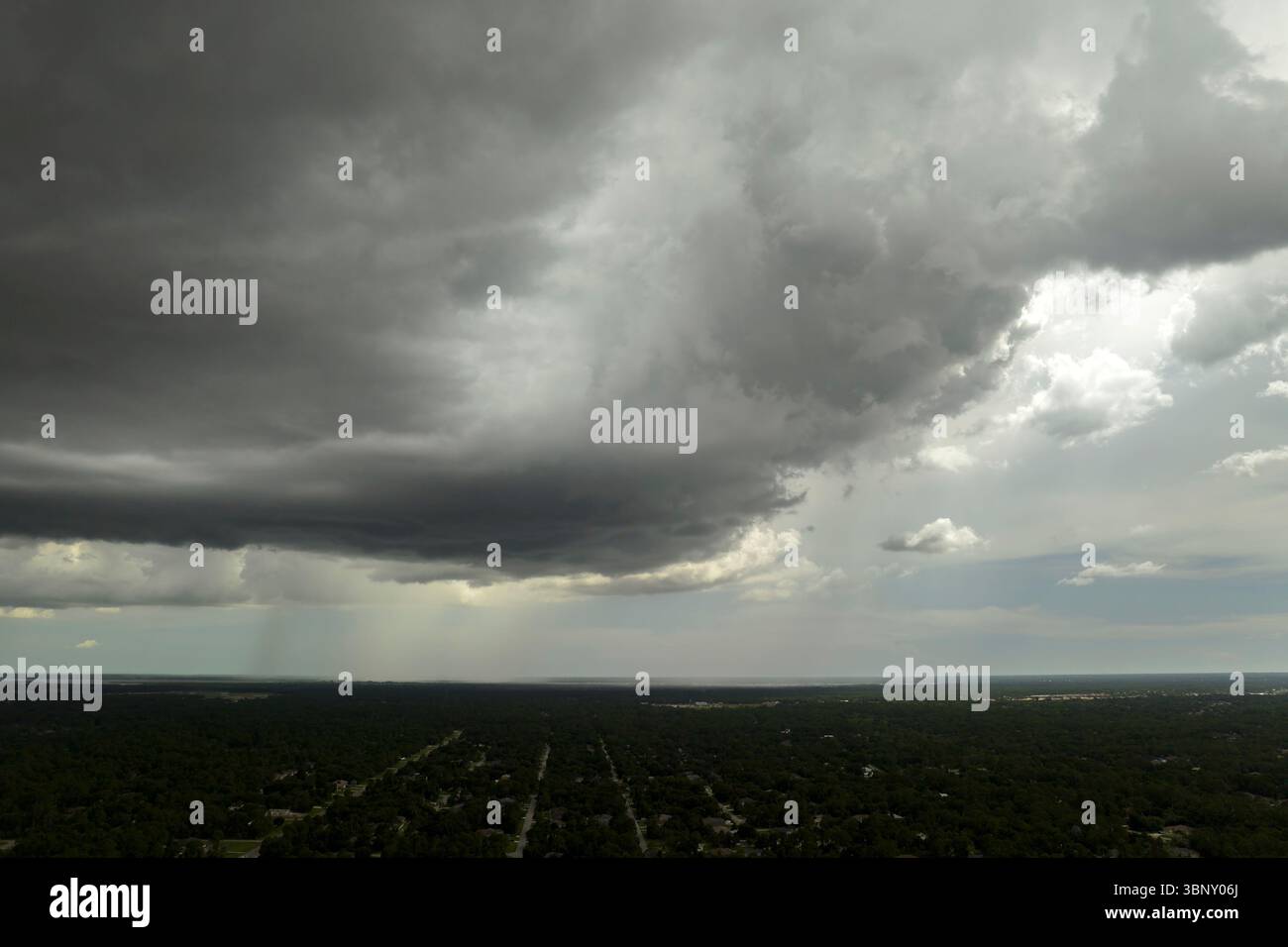 Tropical thunderstorm precipitation falling down on Florida town. Rain ...