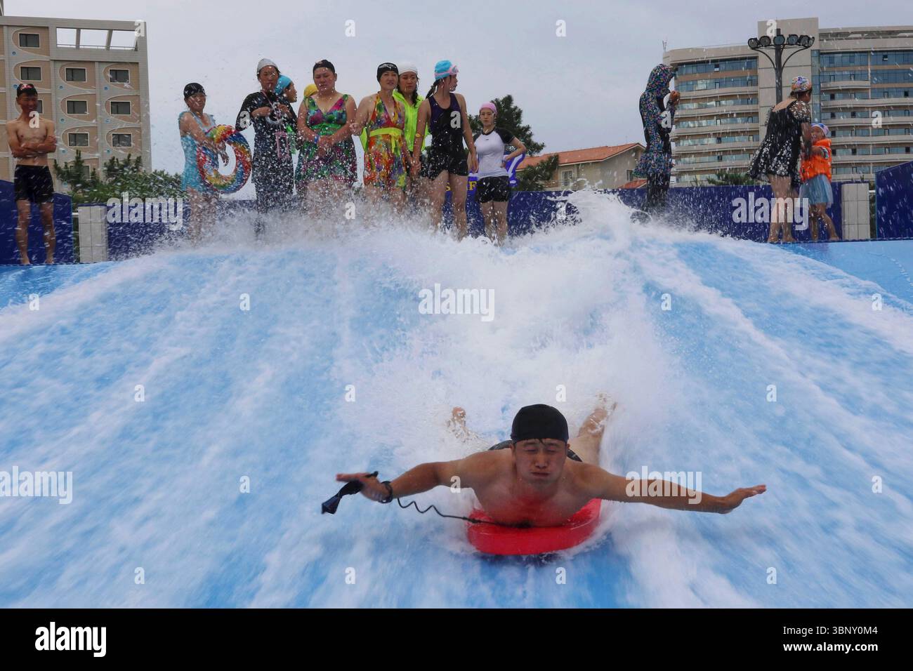 A man plays in the water at the Myongsasimni Water Park of the Wonsan ...