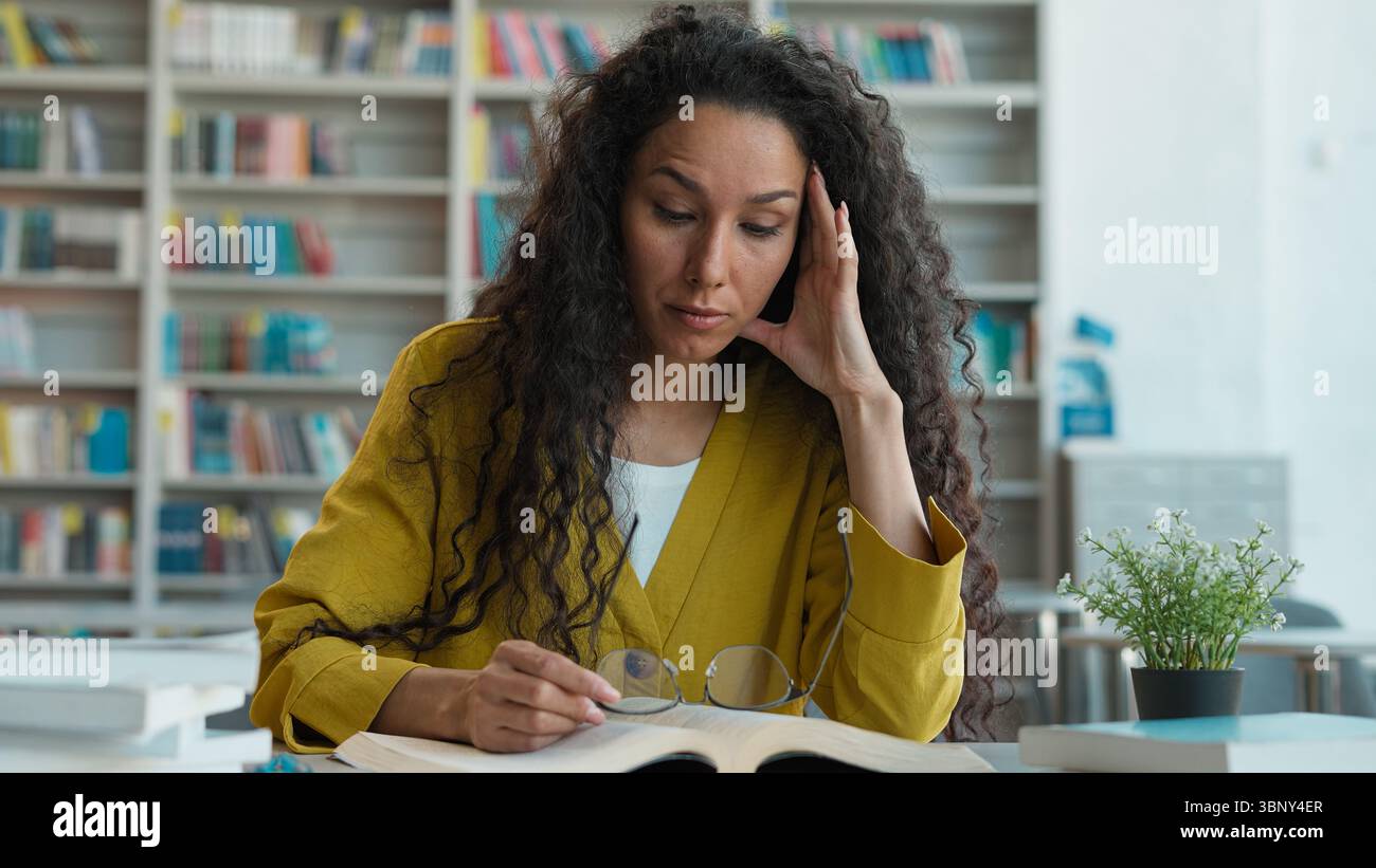 Arabian Latina woman tired exhausted female take off glasses rubbing ...