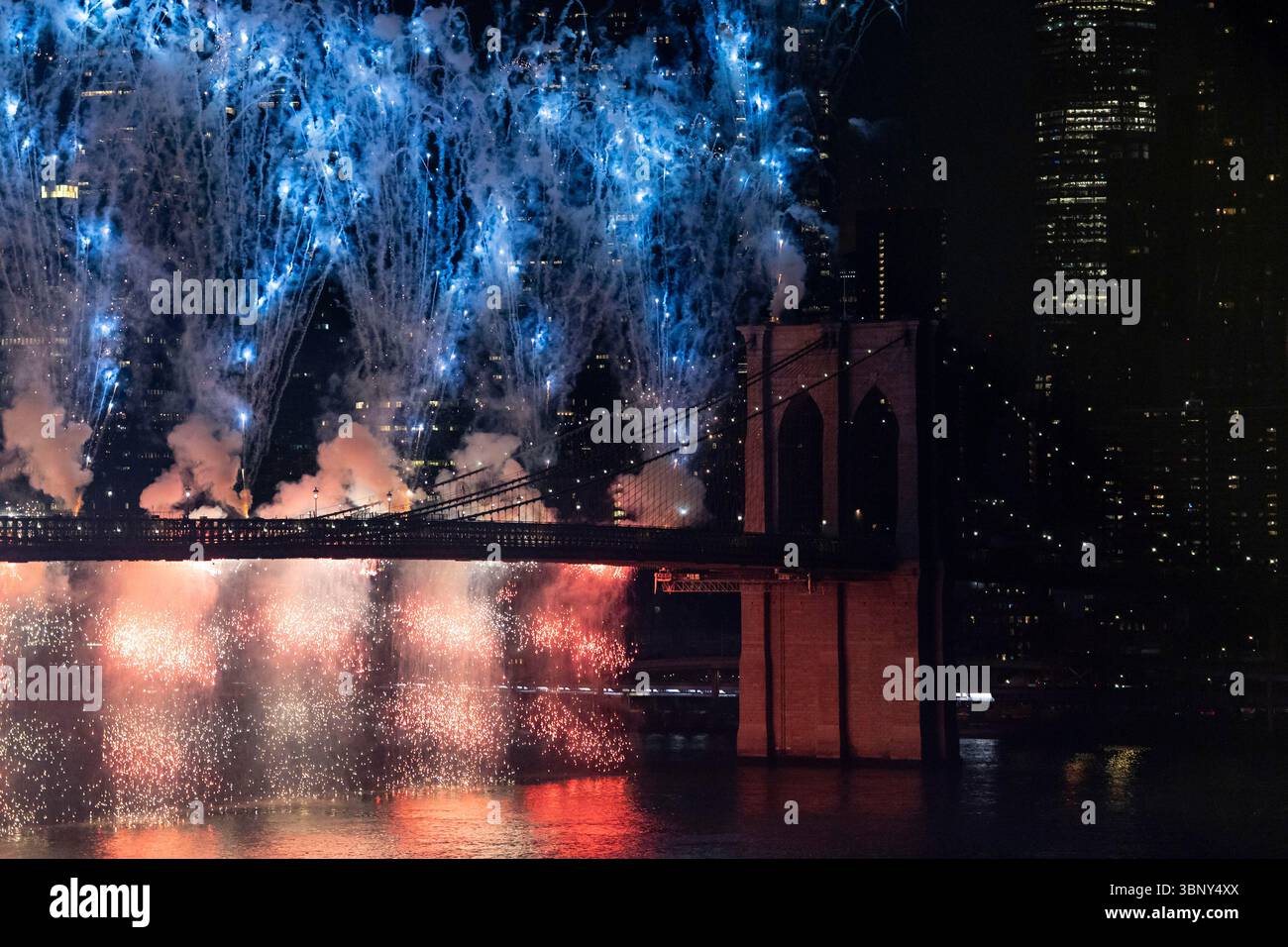 Fireworks light up the sky above the Brooklyn Bridge during the Macy's ...