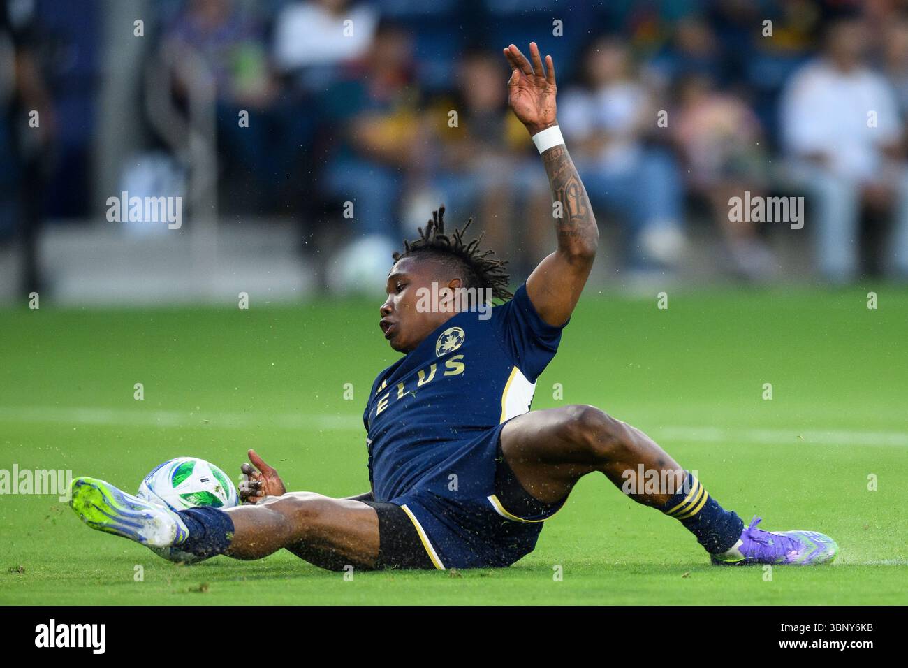 Vancouver Whitecaps defender Édier Ocampo falls while trying to control ...