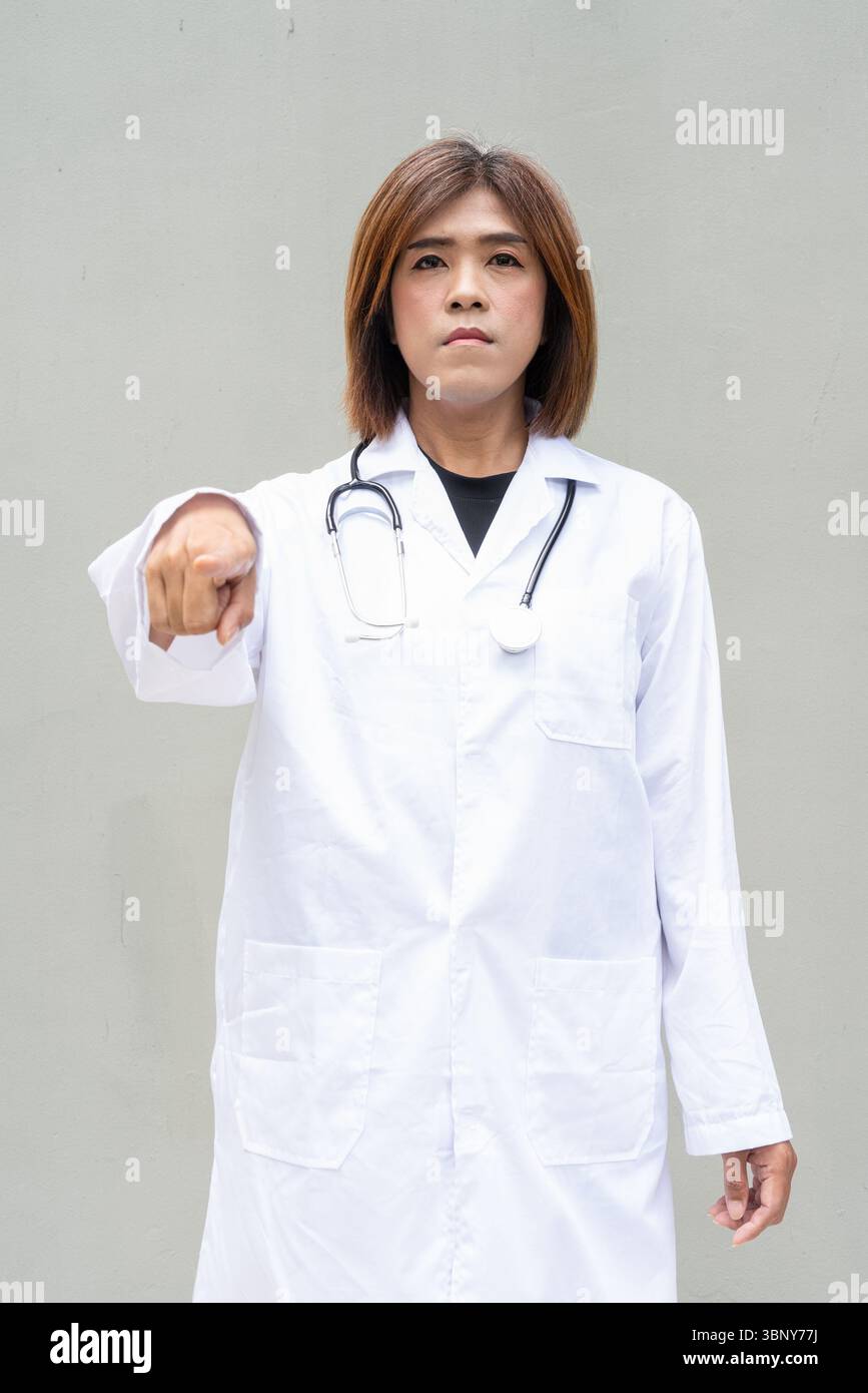 Portrait of Asian transgender non binary doctor with stethoscope ...