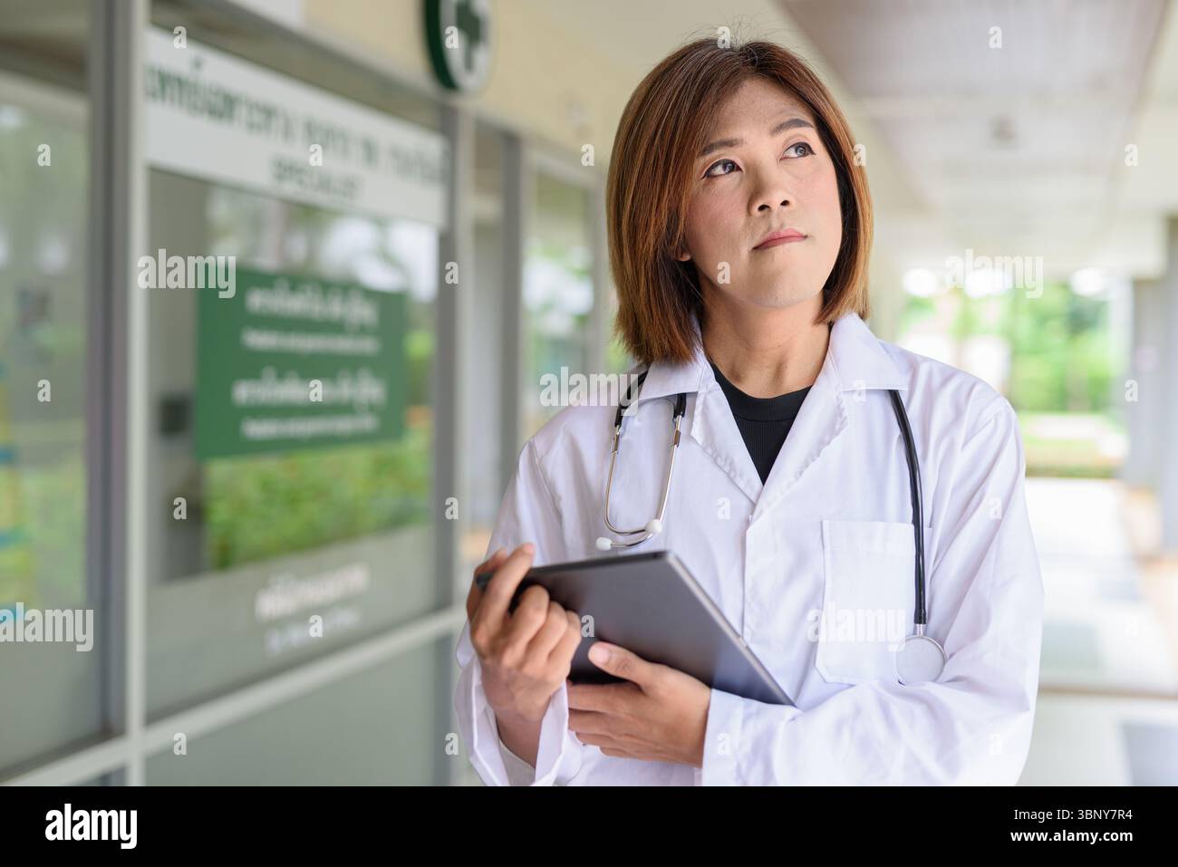 Portrait of Asian transgender non binary doctor with stethoscope. Diversity in healthcare Stock ...