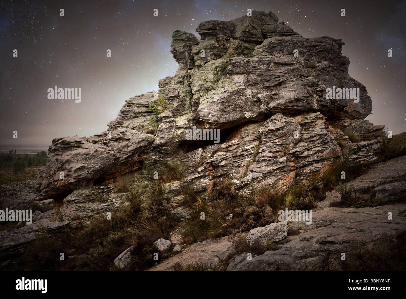 Flat design layered rock formation is rising on hillside under starry ...