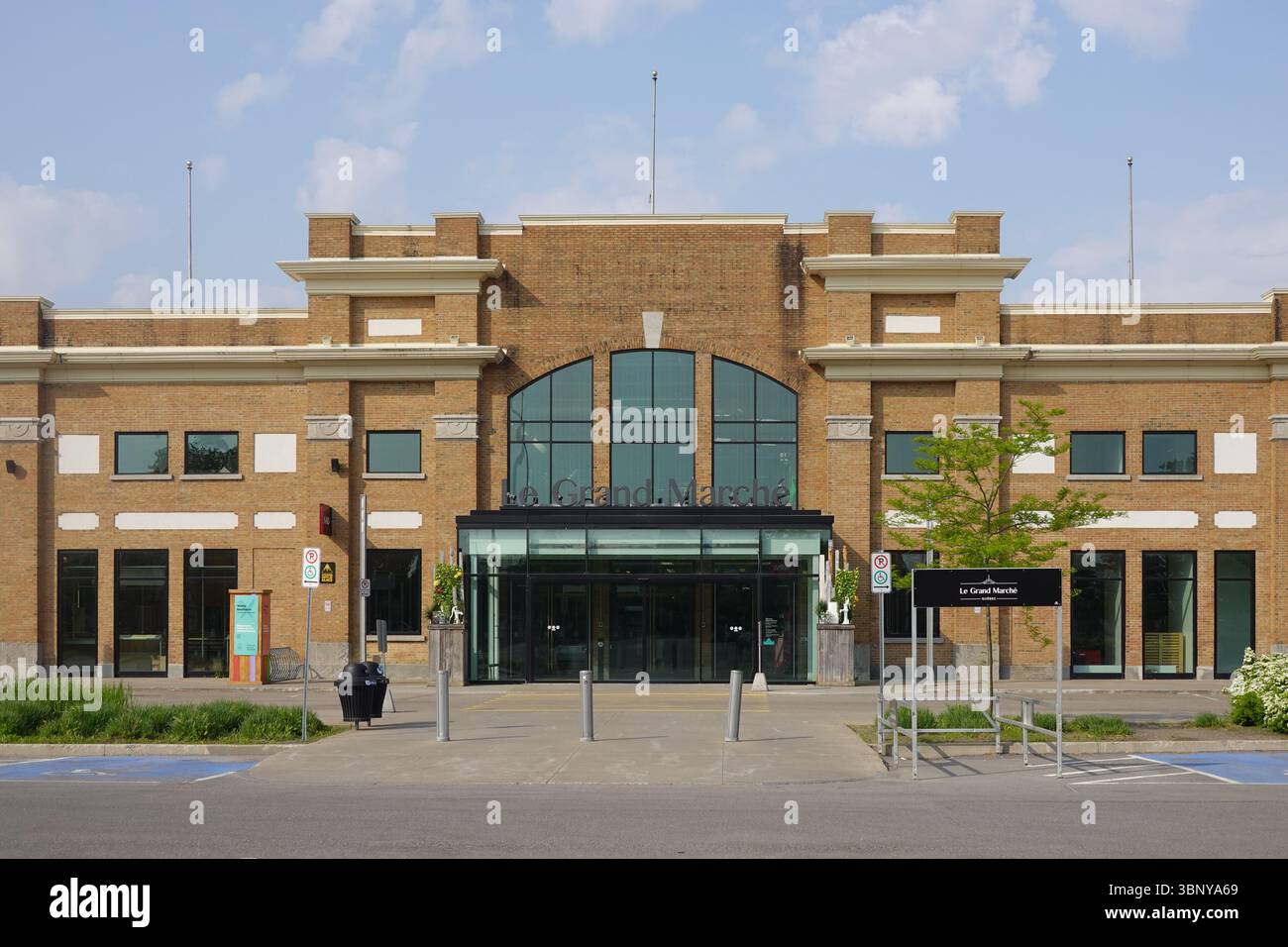 Contemporary brick institutional building with large glass entrance and ...