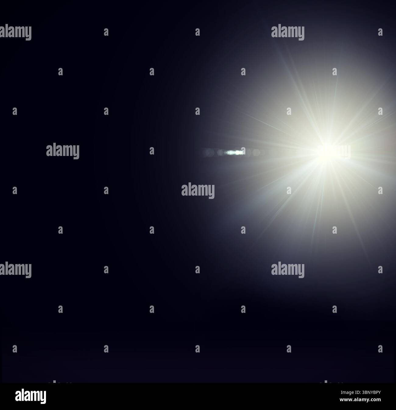 Illuminated light against black background Stock Photo - Alamy