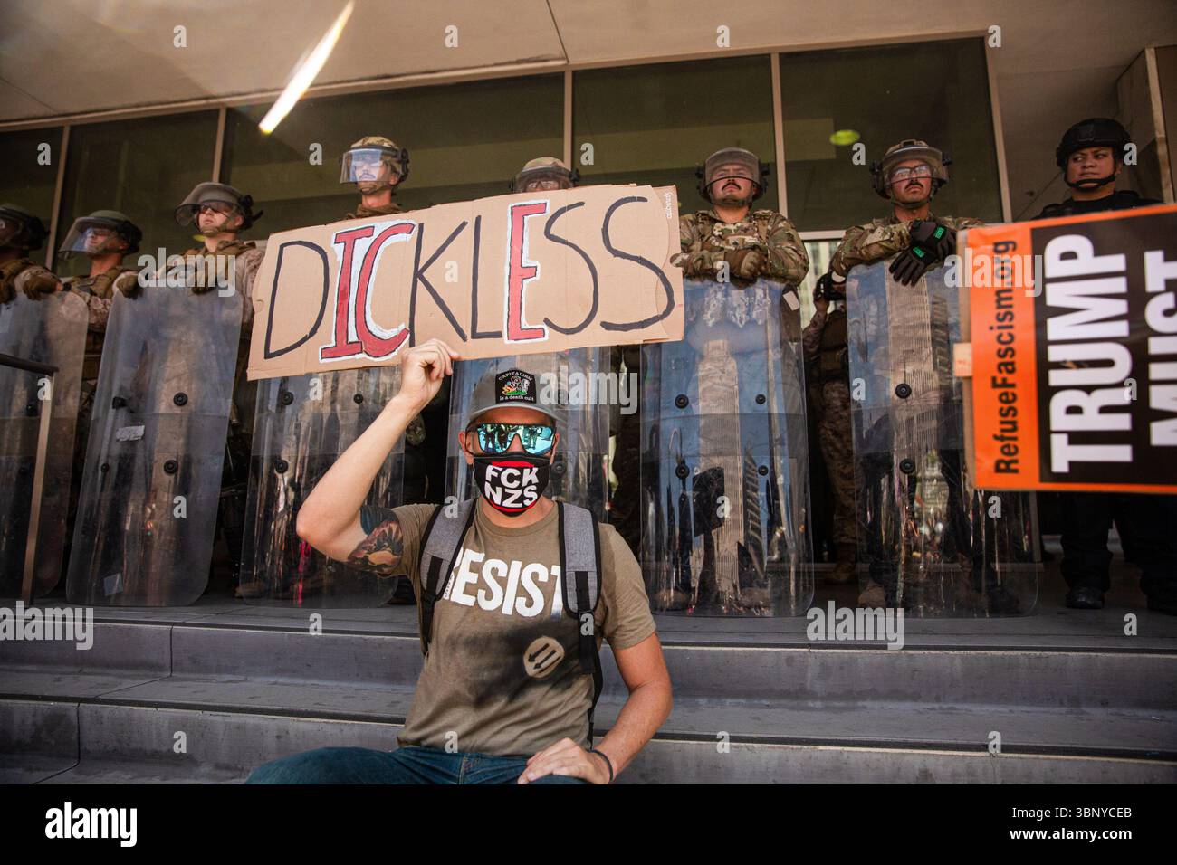 Los Angeles, USA. 05th July, 2025. A man holds a sign in front of U.S ...