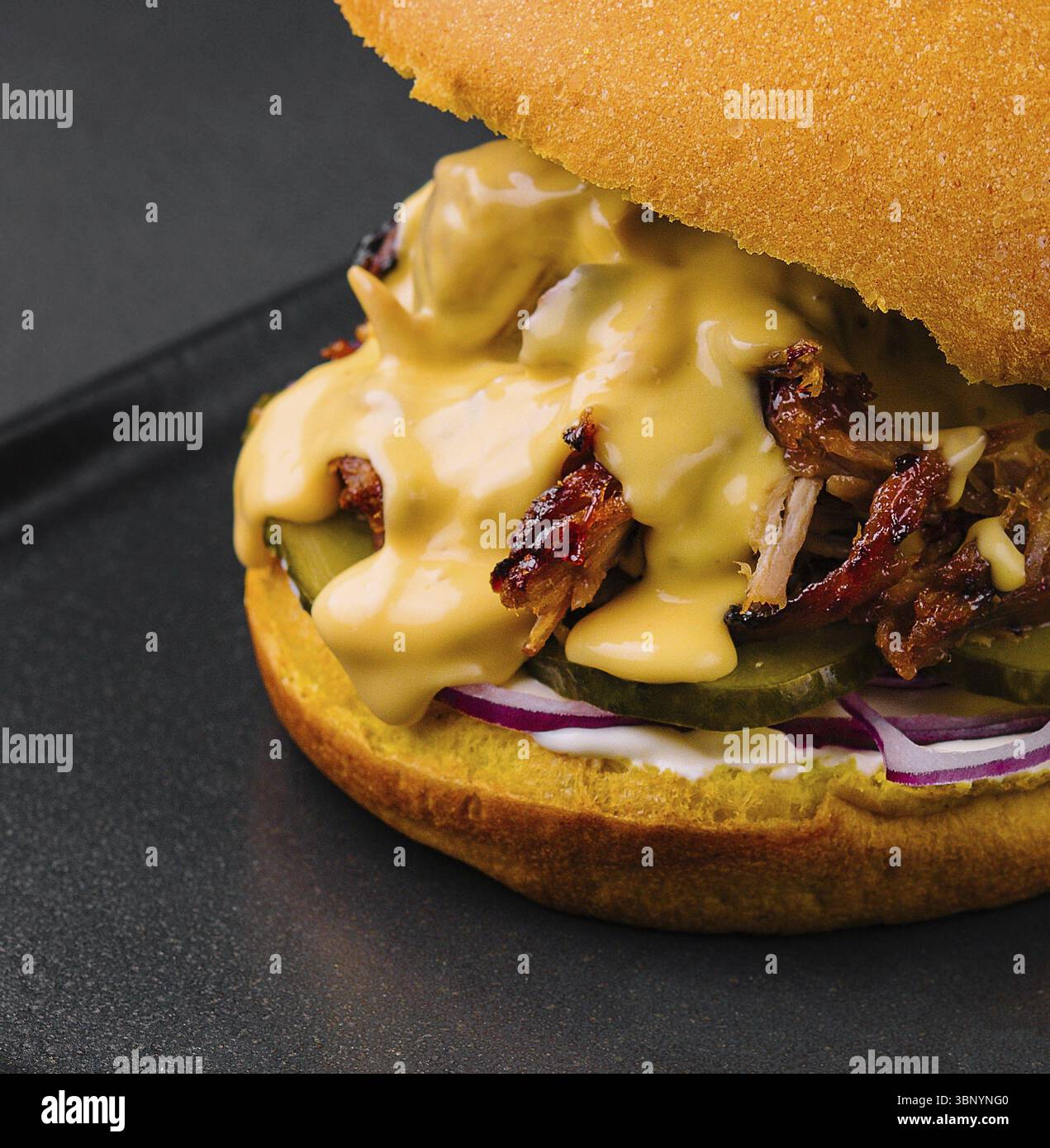 food still-life, Delicious burger with torn meat on black tray Stock ...