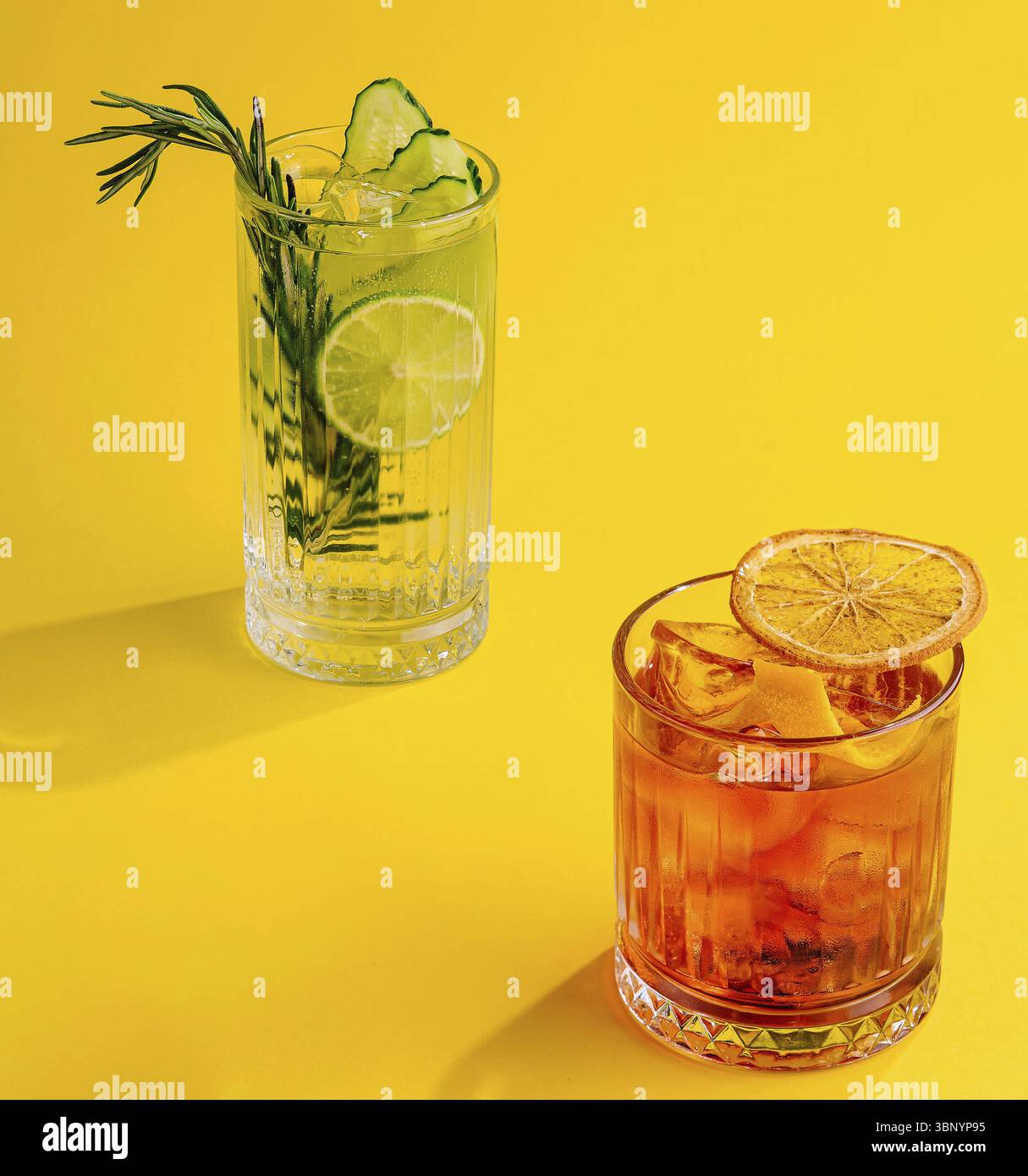Cocktail Negroni and mojito cocktail on yellow background Stock Photo ...