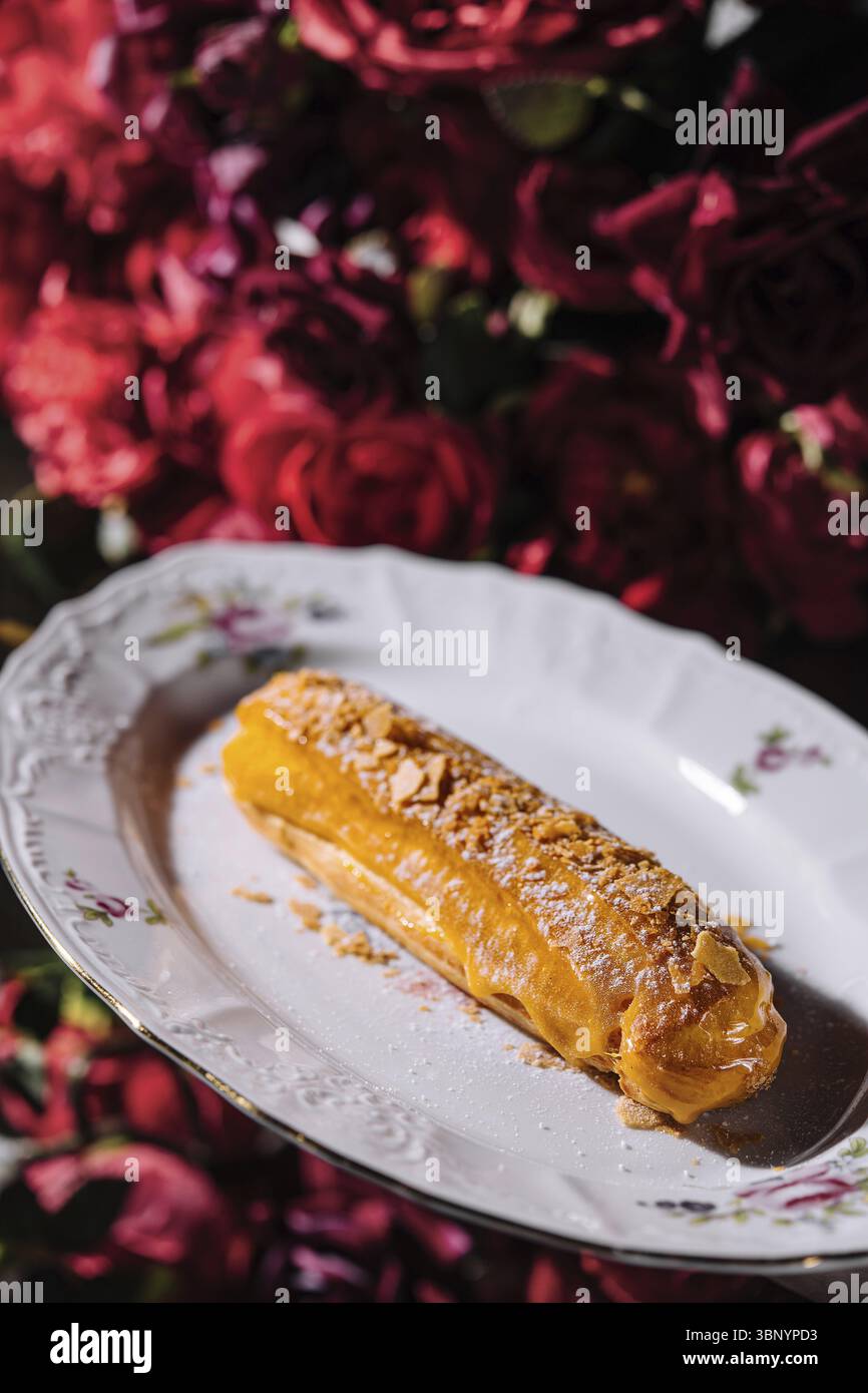 French Artisan Eclair on plate top view Stock Photo - Alamy