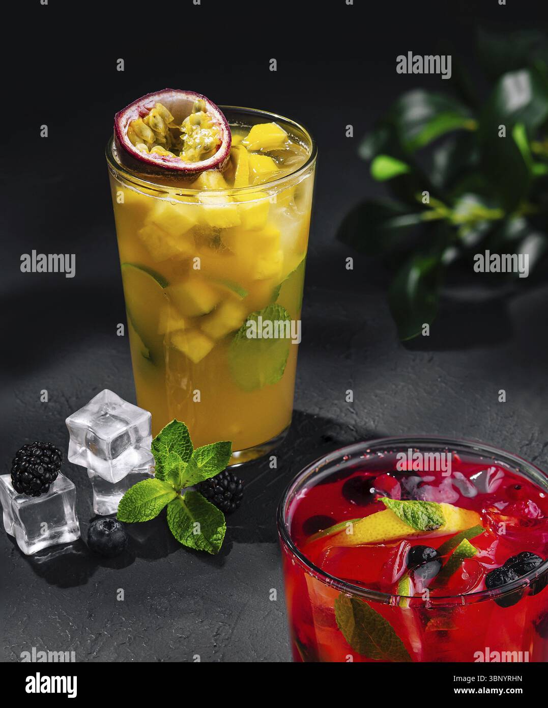 Tropical cocktails with ice cubes Stock Photo - Alamy