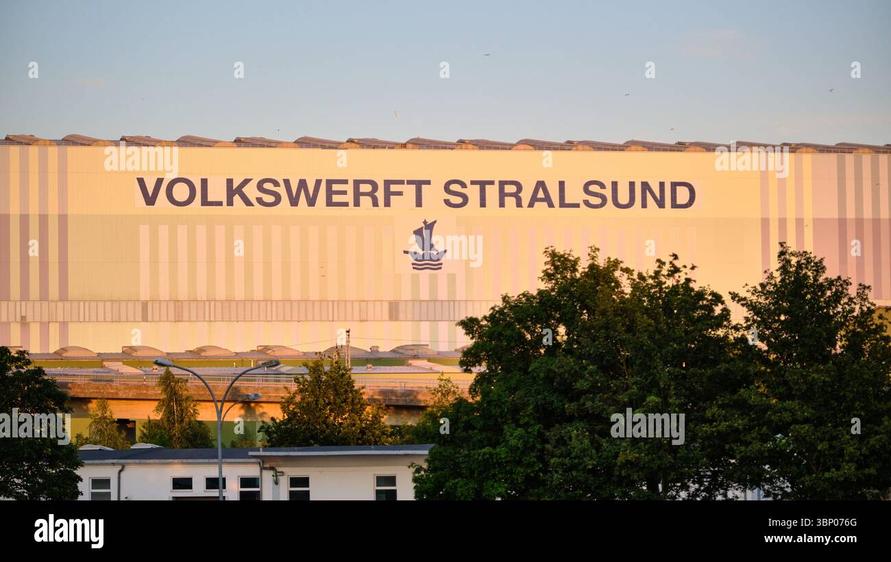June 30, 2025 - Stralsund-Germany: The Volkswerft shipyard hall glows ...