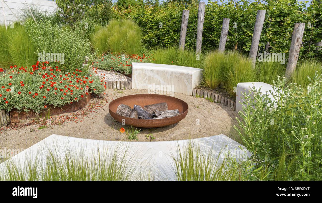 Garden design with natural sand terrace, marram grass and metal ...